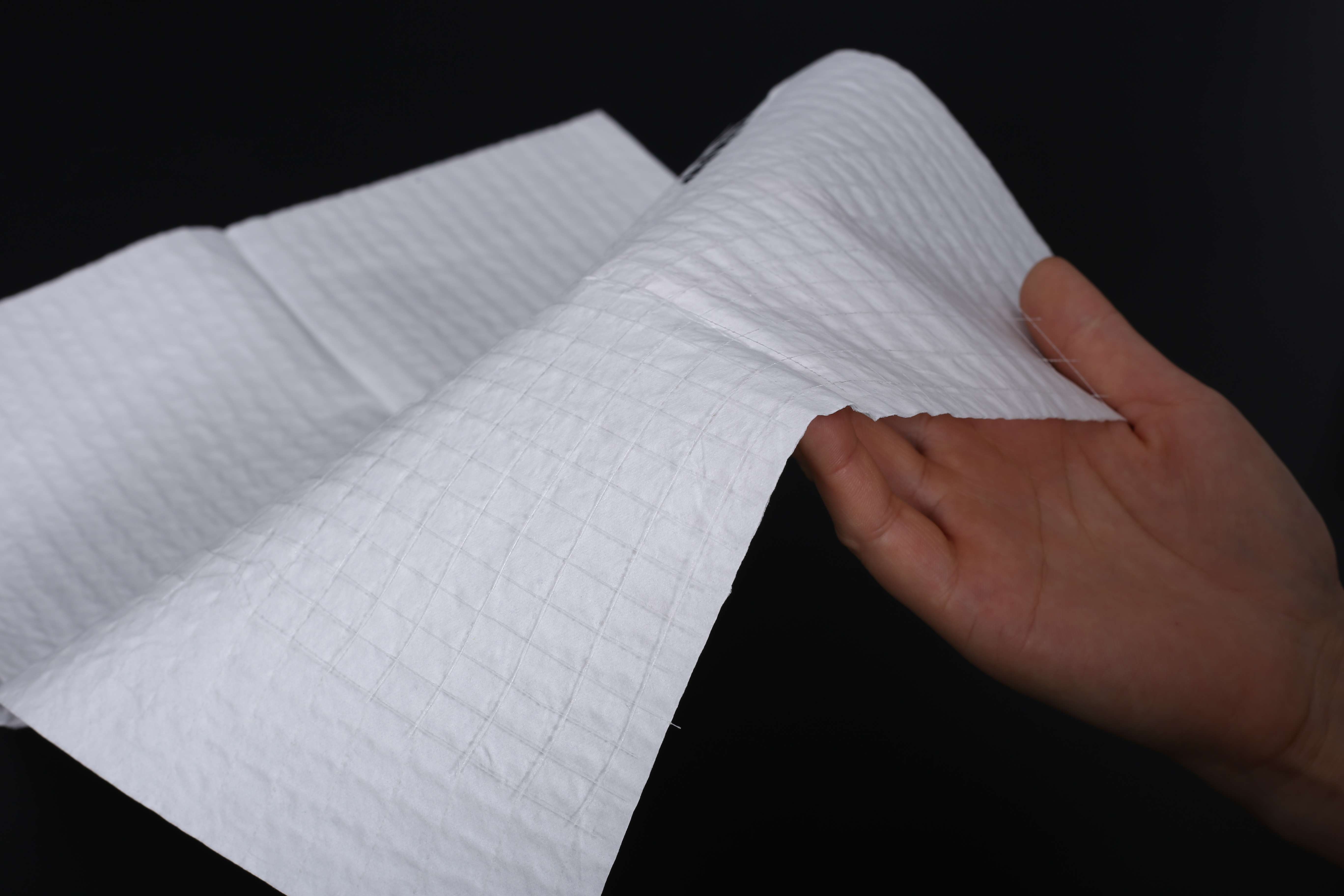 Polyester mesh laid scrims for reinforced medical blood-absorbing paper ...